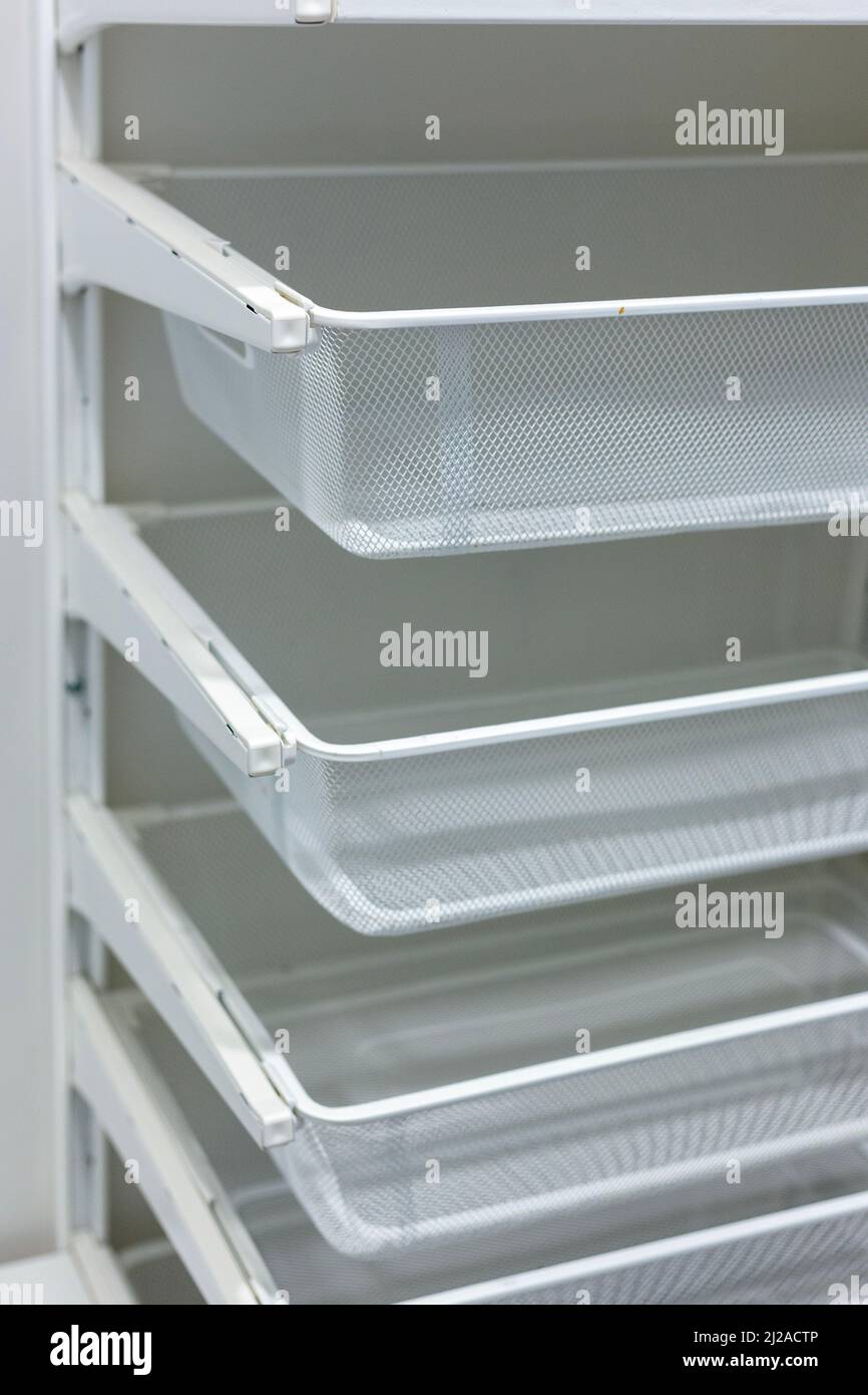 White Mesh Metal Shelves for Closet Storage Stock Photo - Alamy