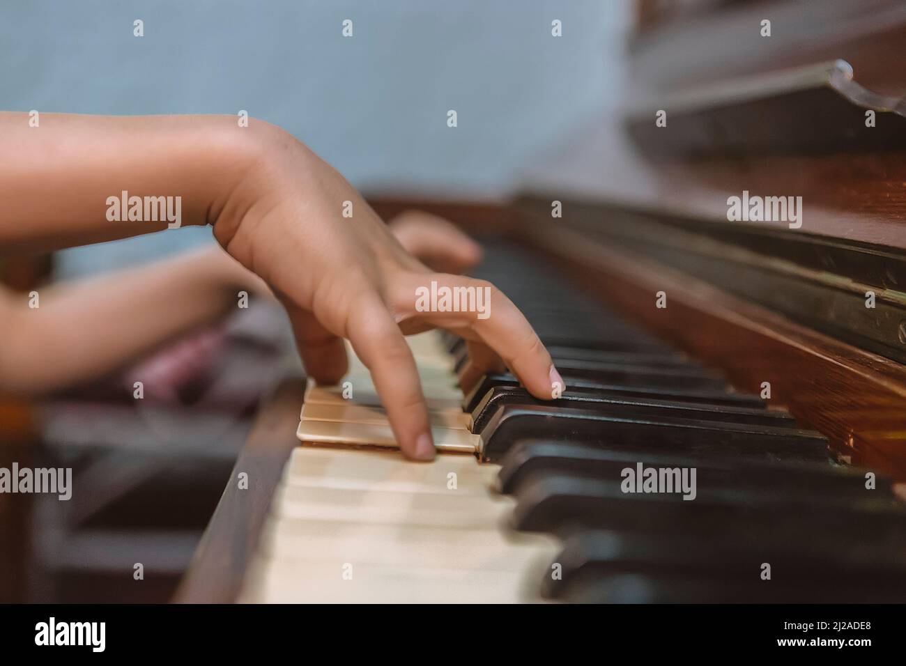 close-up with child's hands on piano keys Stock Photo - Alamy