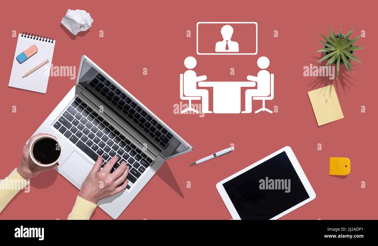 Top view of hands using laptop with symbol of video conference concept ...