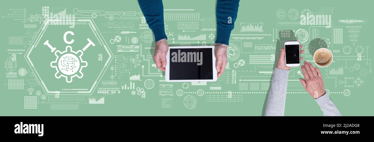 Top view of hands using digital tablet and mobile phone with symbol of ...