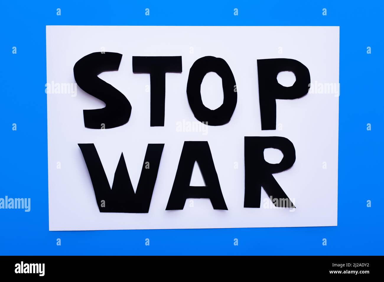 Top view of stop war lettering on white and blue background,stock image ...