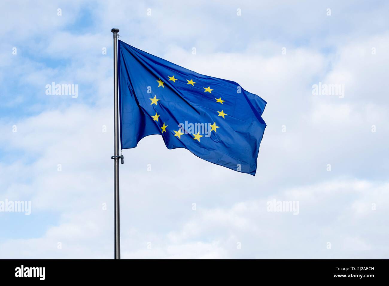 Panoramic view of a waving EU flag or European Union flag against blue ...