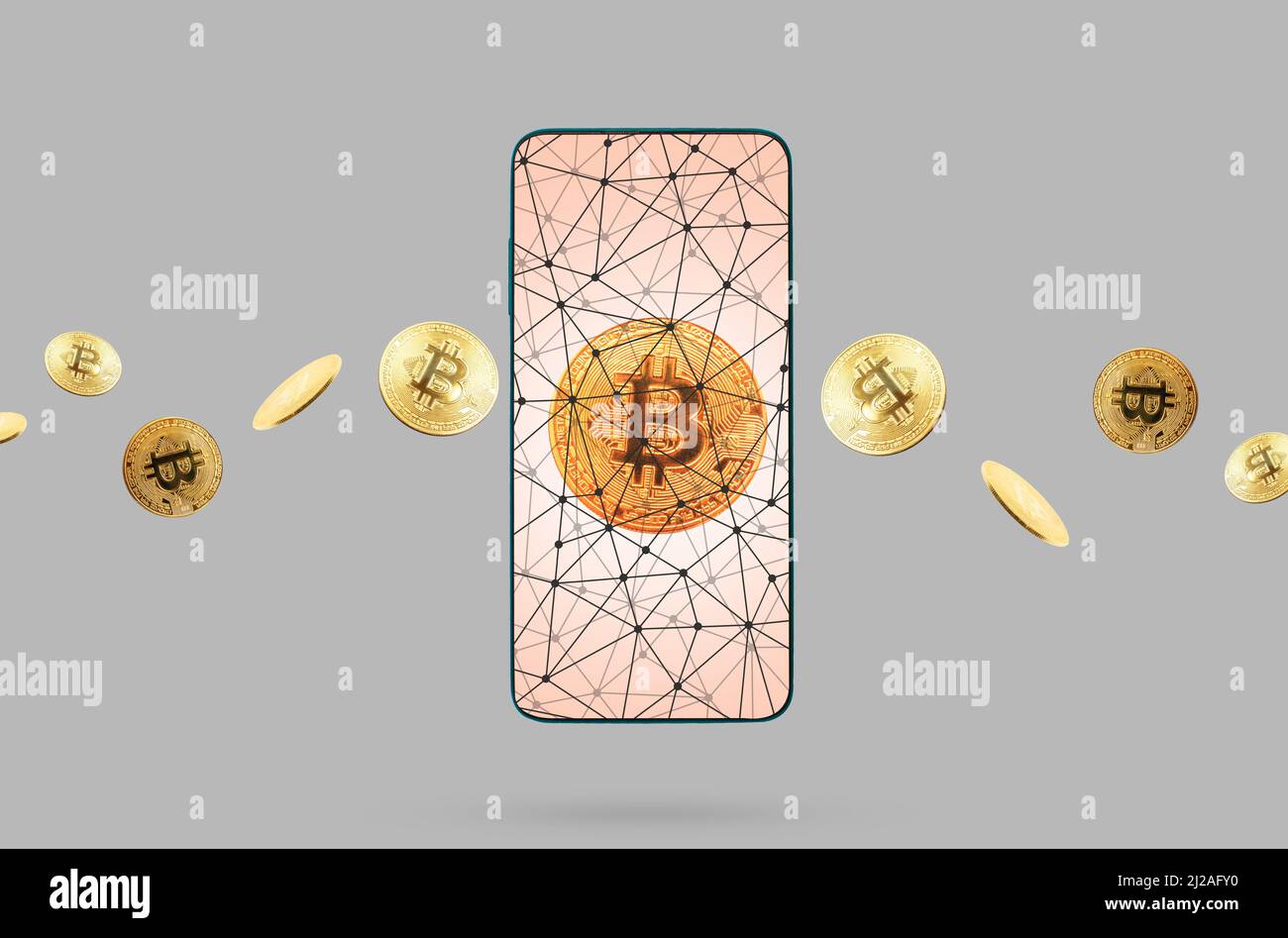 Close up of cell phone with bitcoins in screen and gray background ...
