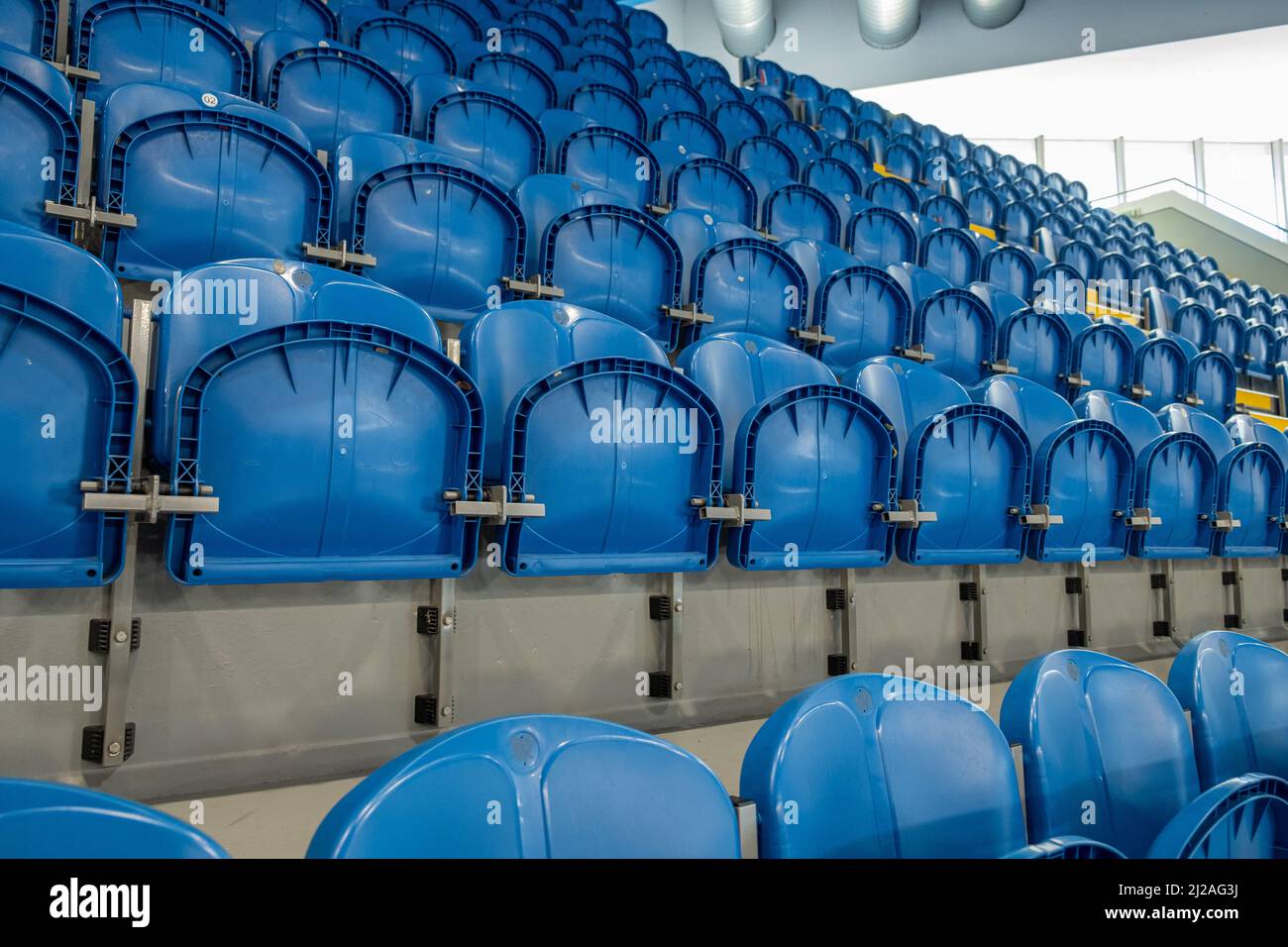 empty blue bleachers of a sports center building Stock Photo - Alamy