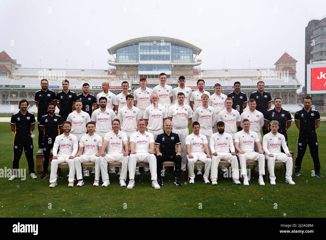 Nottinghamshire CCC pose for a team photograph as snow falls during a ...