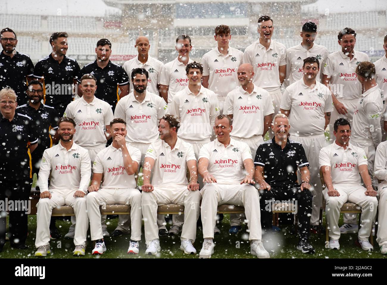 Nottinghamshire CCC pose for a team photograph as snow falls during a ...