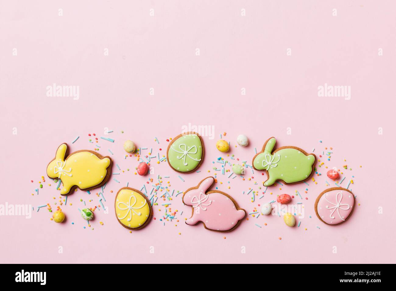 holiday preparation Multi colors Easter eggs with cookies on colored ...