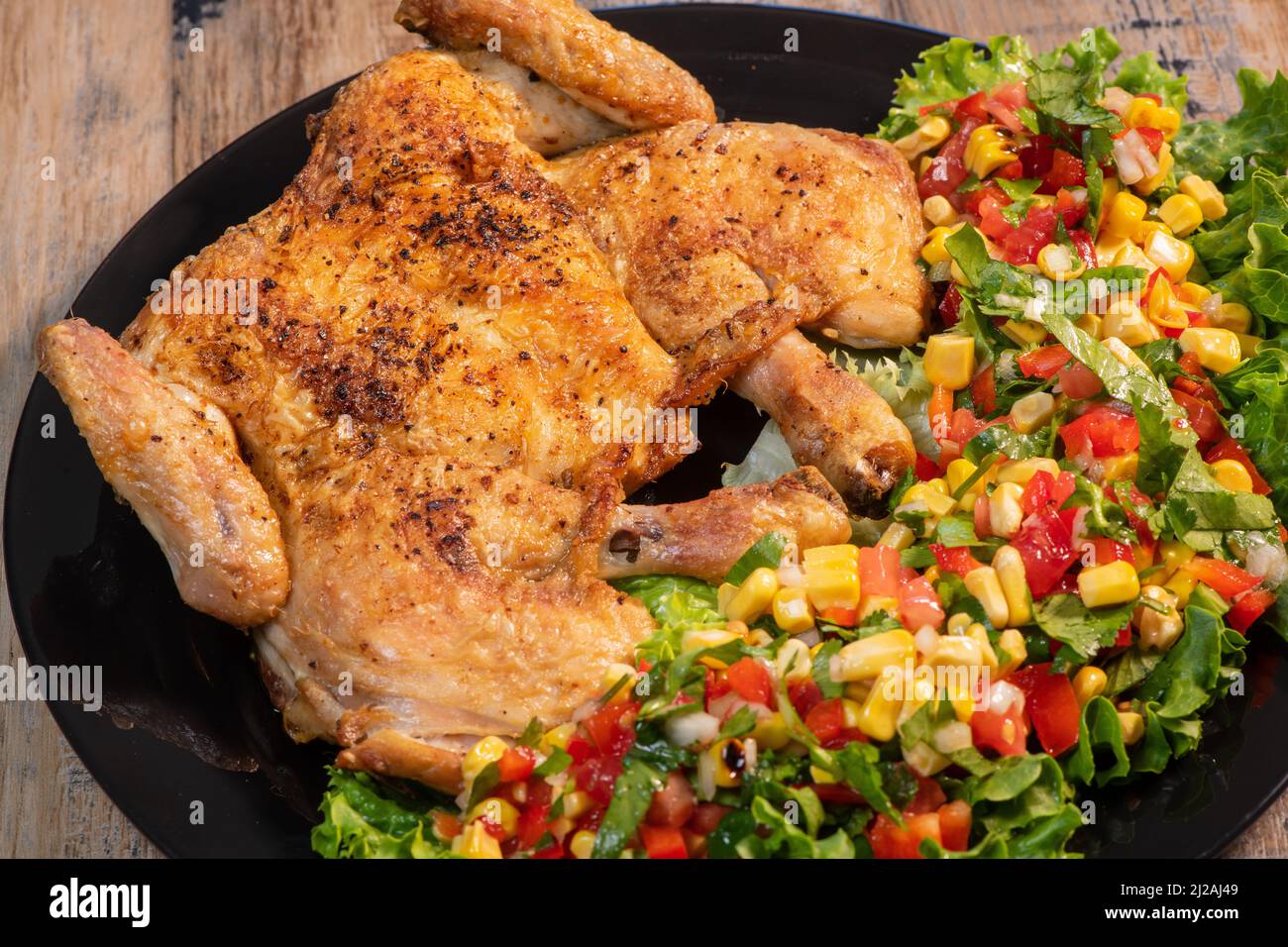 Chicken recipe, roast cockerel and its vegetables, corn condiment Stock ...
