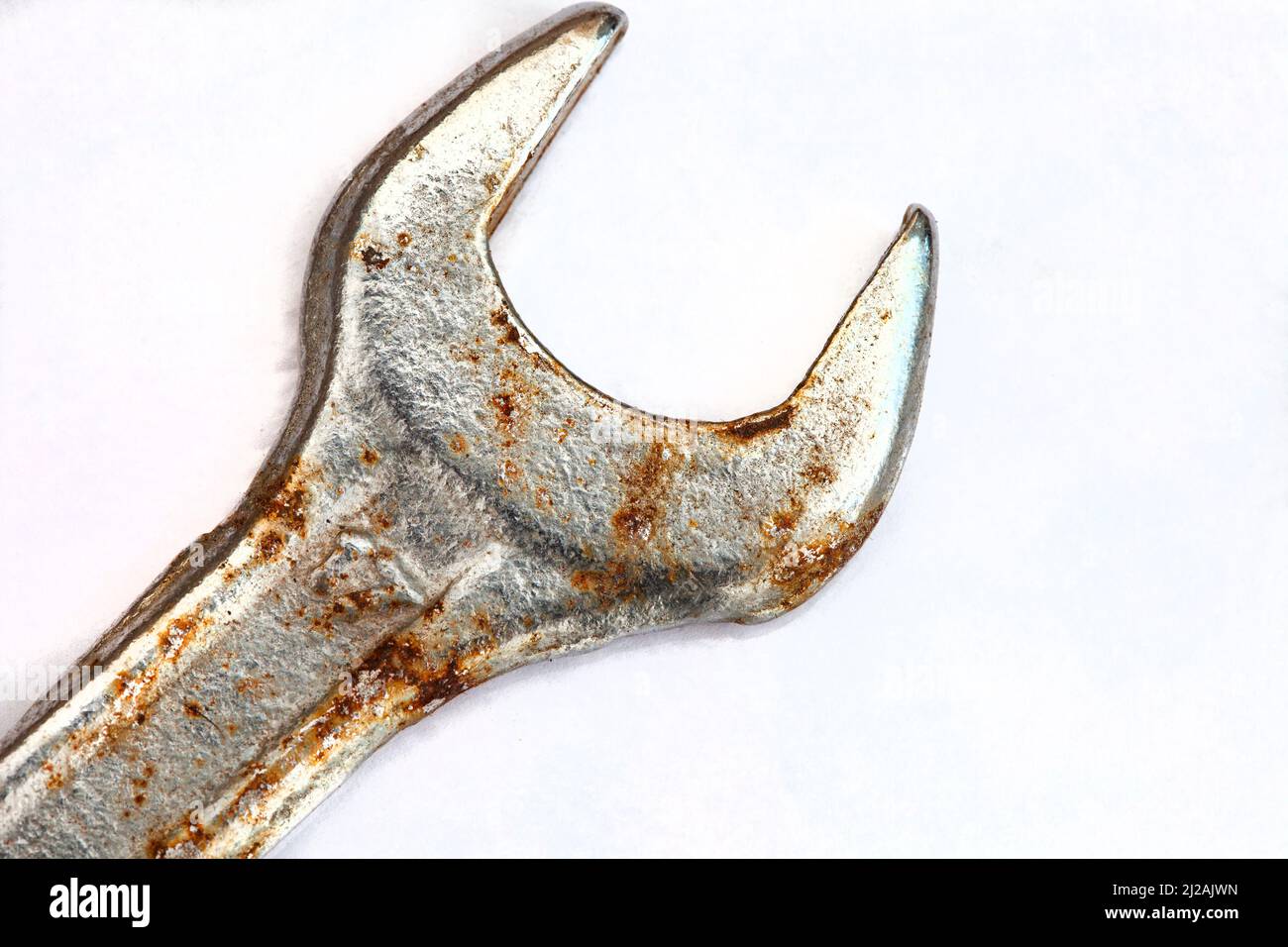 Close up of used rusty spanner isolated on white background Stock Photo ...
