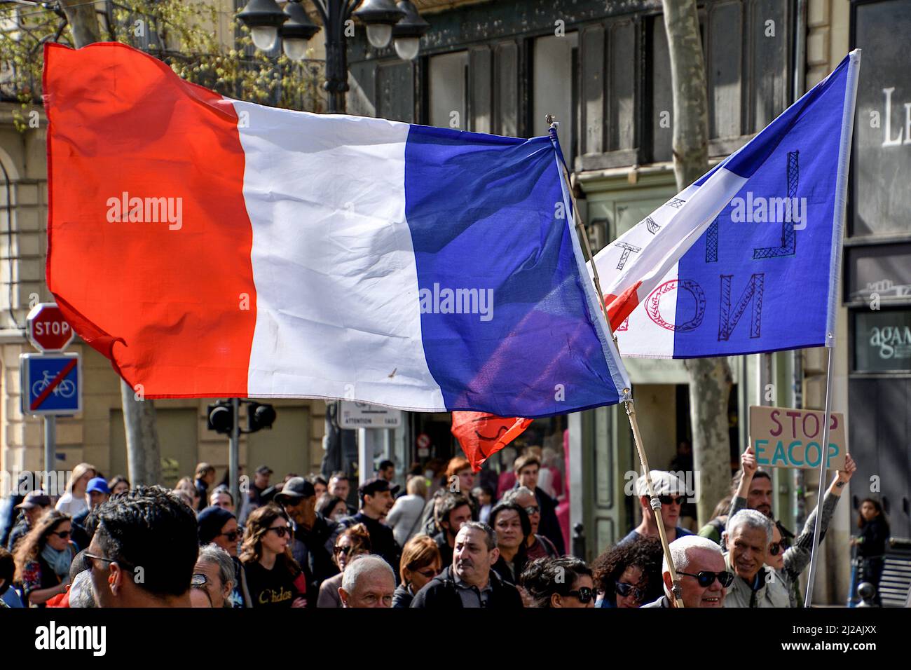 Protesters hold flags during the demonstration. Activists from the ...