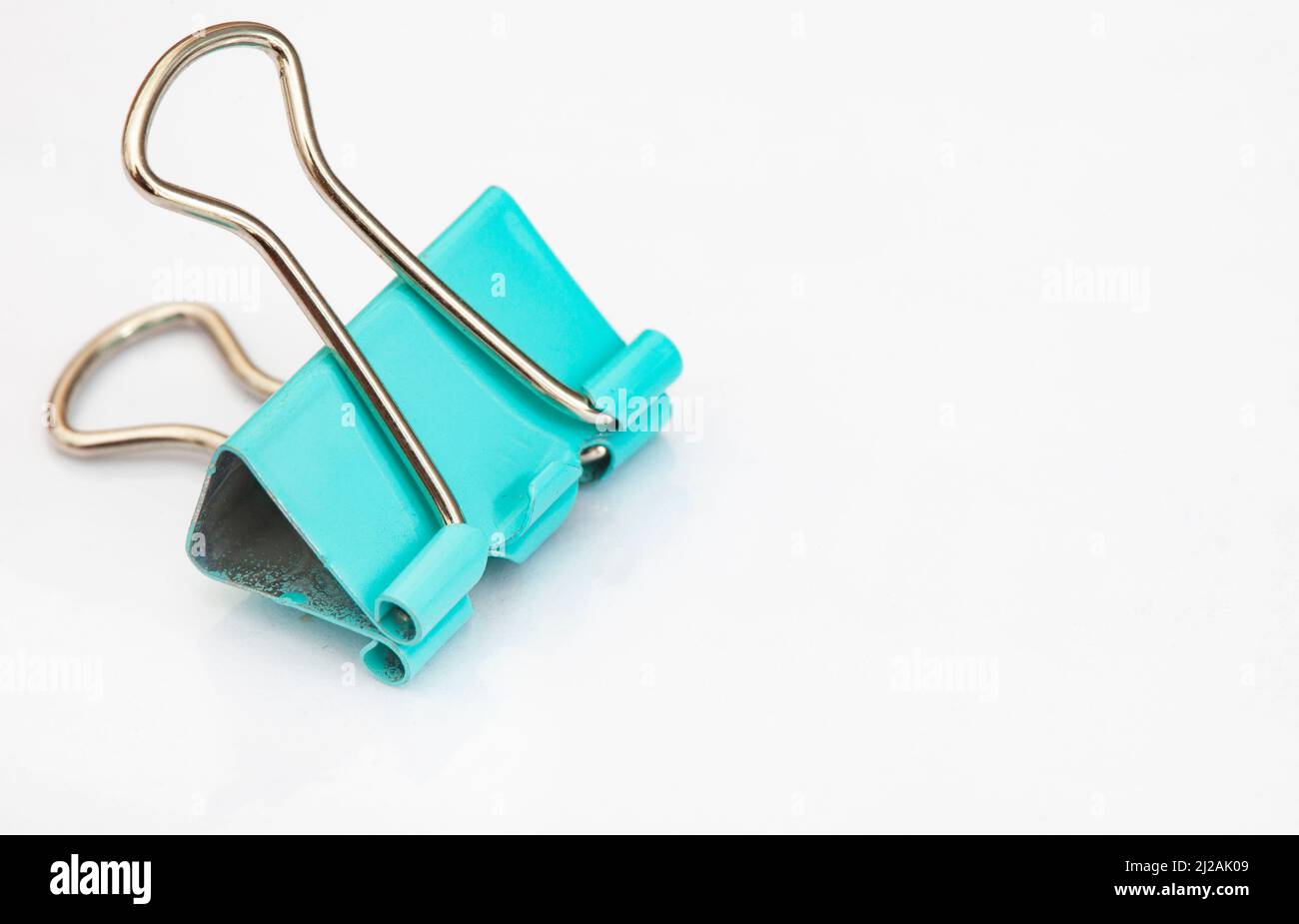 pastel colored paper clamping clip isolated on white background Stock ...