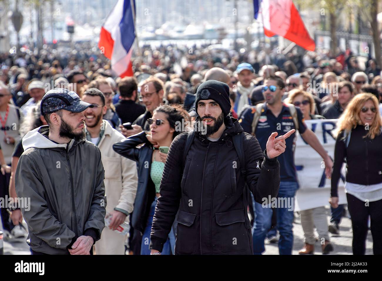 Marseille, France. 26th Mar, 2022. Protesters march through the street ...