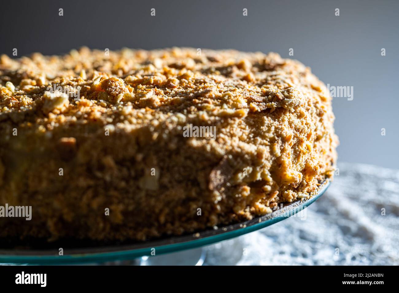Famous Napoleon cake baked and served on glass salver decorated with ...
