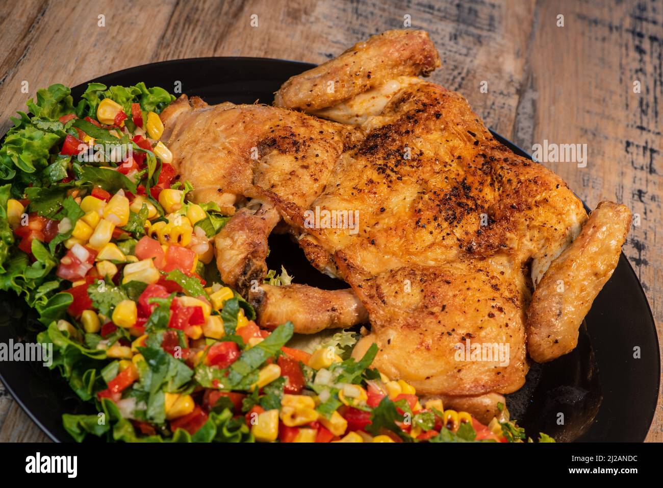 Chicken recipe, roast cockerel and its vegetables, corn condiment Stock ...