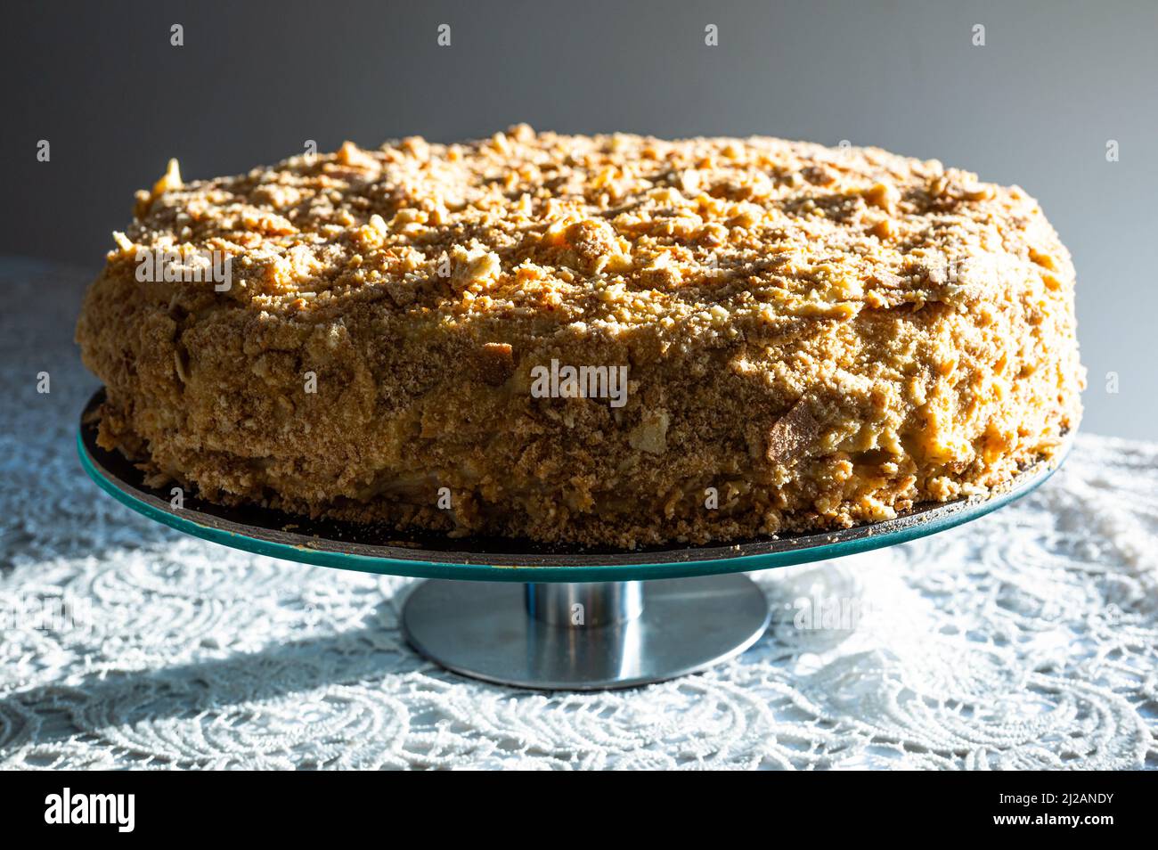 Famous Napoleon cake baked and served on glass salver decorated with ...