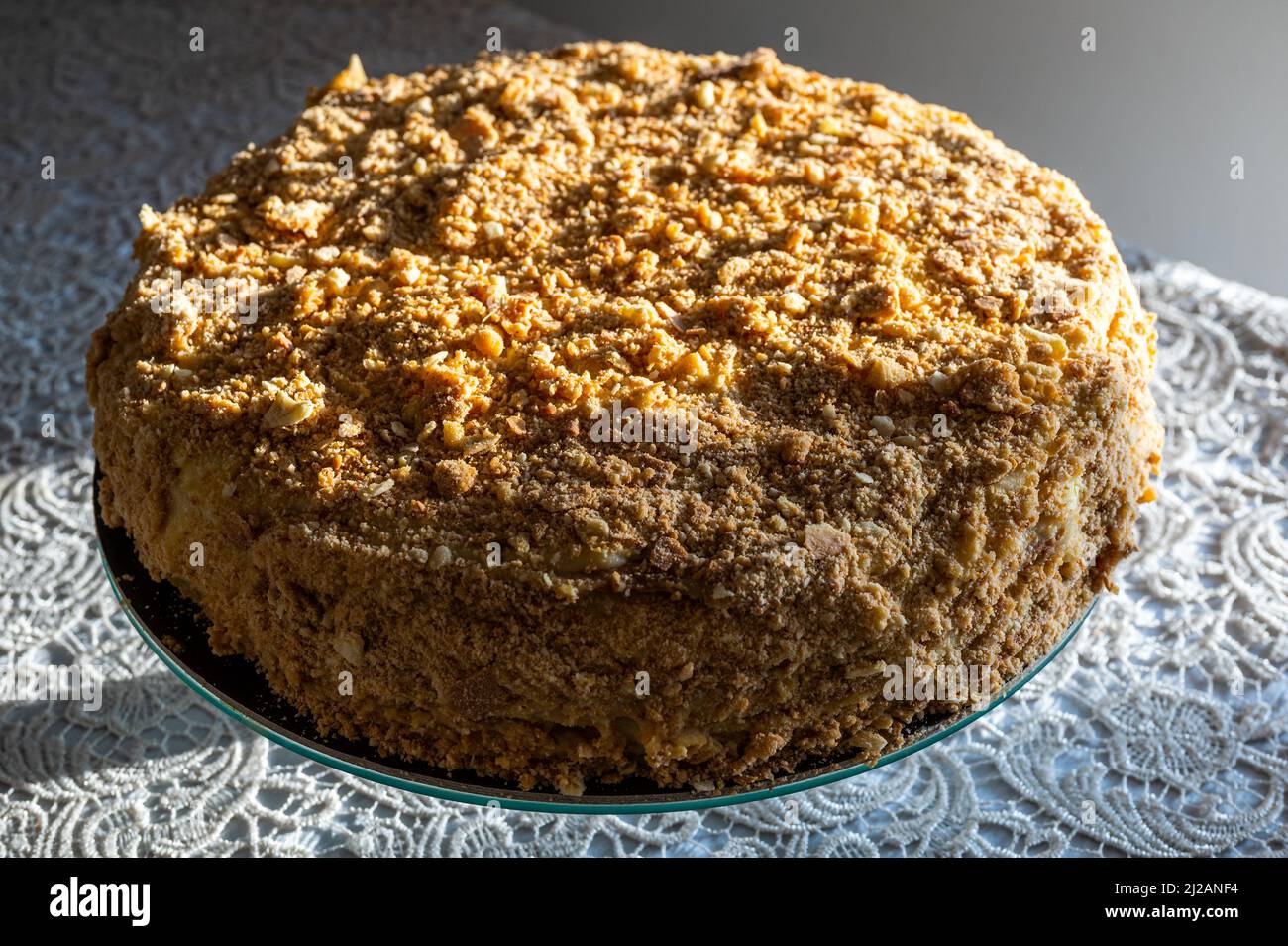 Famous Napoleon cake baked and served on glass salver decorated with ...