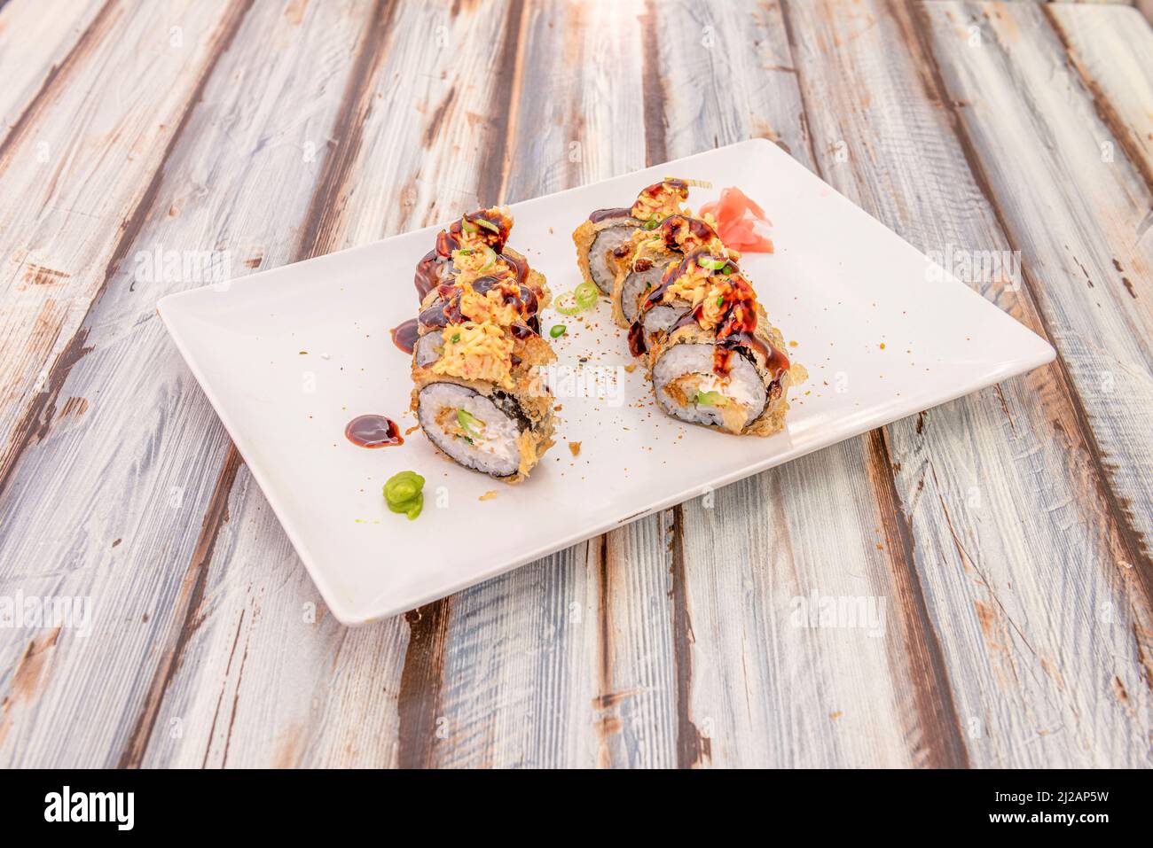 Fat maki roll sushi with nori seaweed, cream cheese, soy sauce, crispy ...