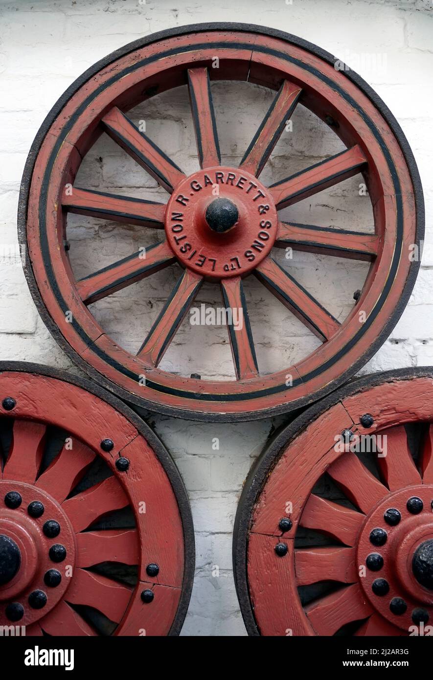vintage wooden old fashioned steel rimmed cart wheels Stock Photo - Alamy