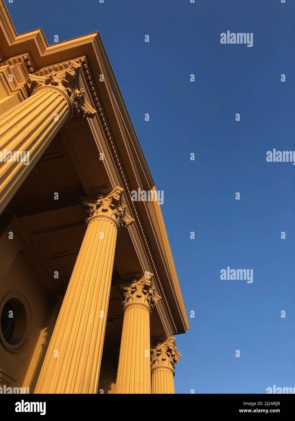 an impressive historic building with columns of Roman architecture ...