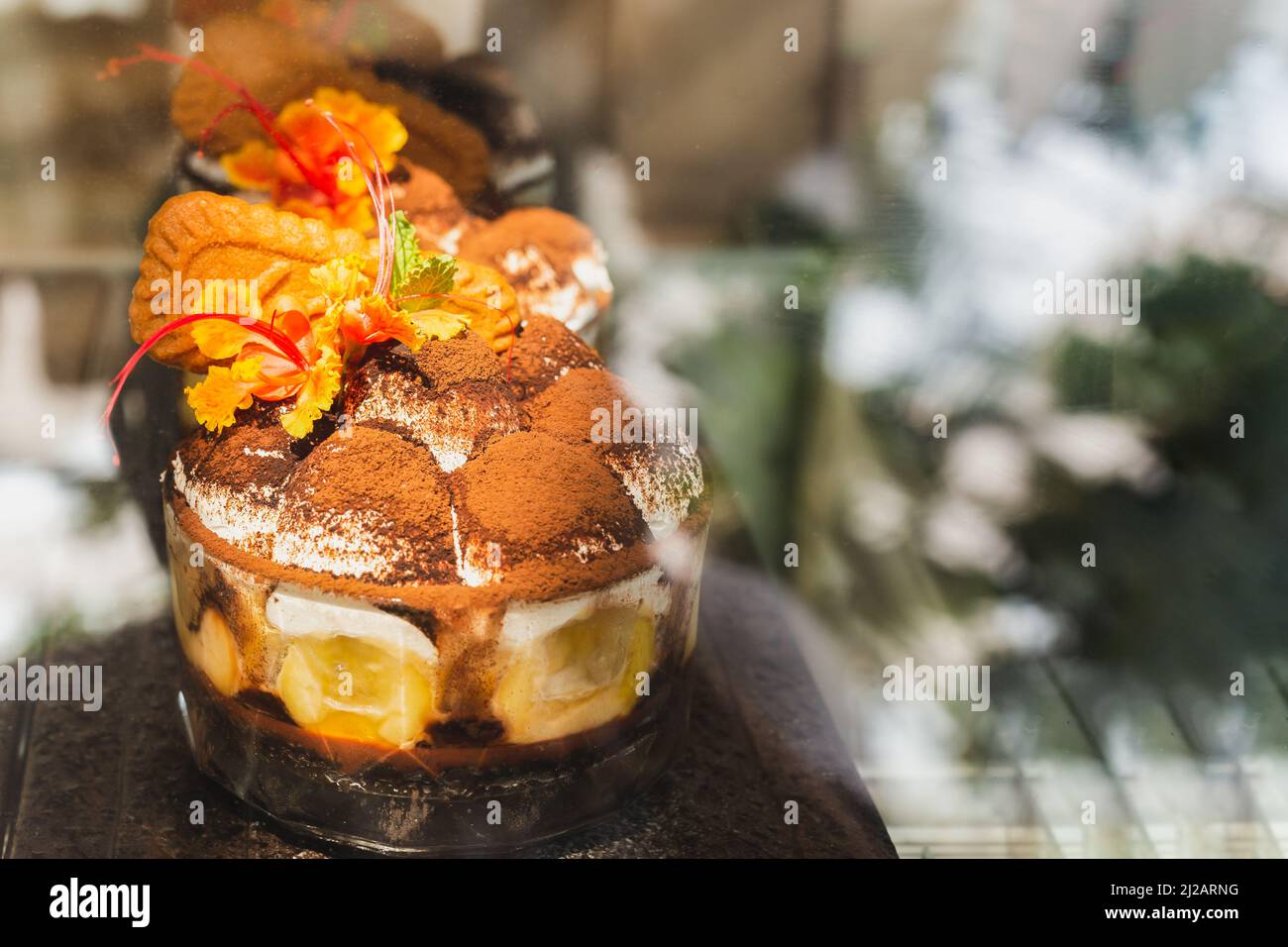 Traditional Banoffee dessert with caramel, banana, and whipped cream ...