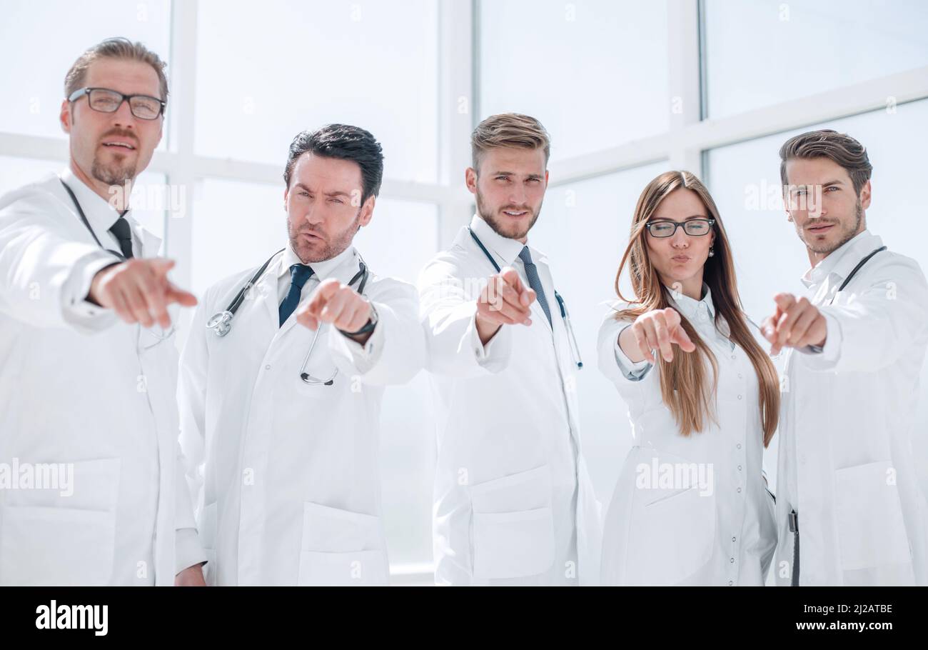 group of practicing doctors pointing their finger at you Stock Photo ...