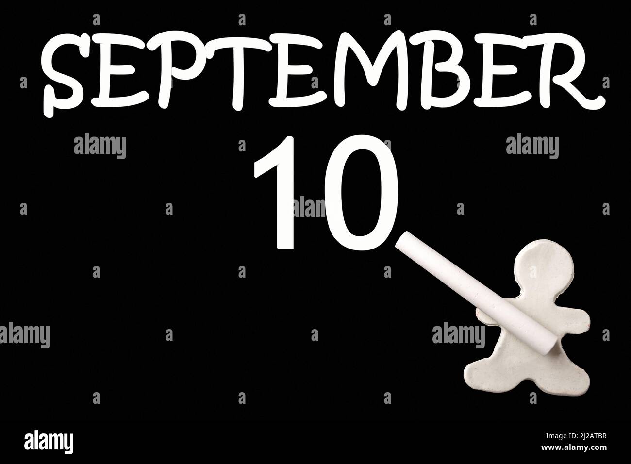 10th day of September. A small white plasticine man writing the date 10 ...