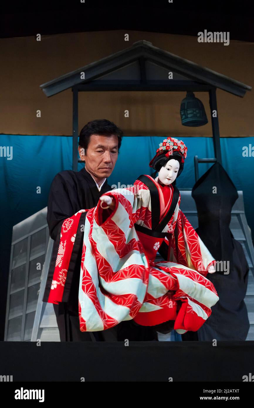 Vertical close-up view of a Japanese puppet traditional performance in ...