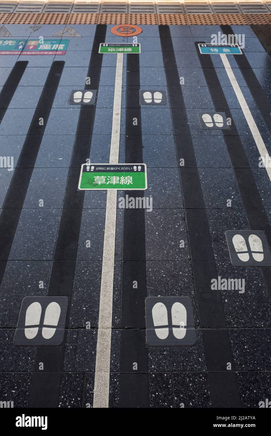 Vertical view of the floor footprints marks to keep the passengers ...