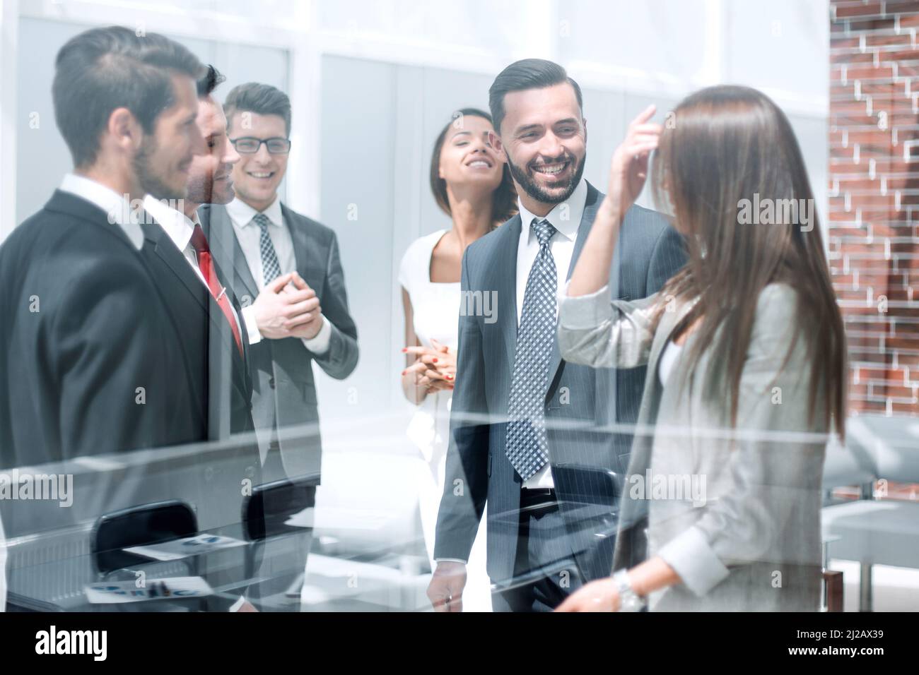 employees discuss business documents standing in the office Stock Photo ...