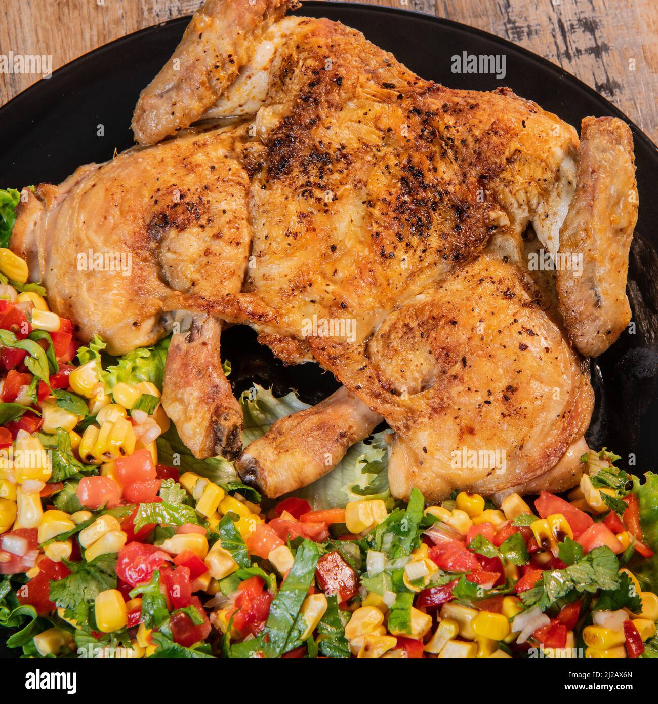 Chicken recipe, roast cockerel and its vegetables, corn condiment Stock ...