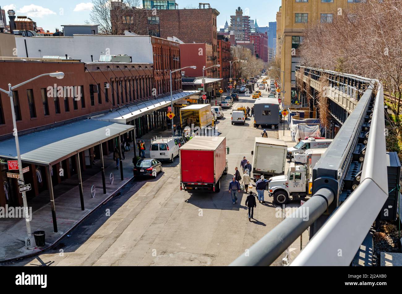 City Street in Chelsea with lots of traffic, trucks parked on the ...