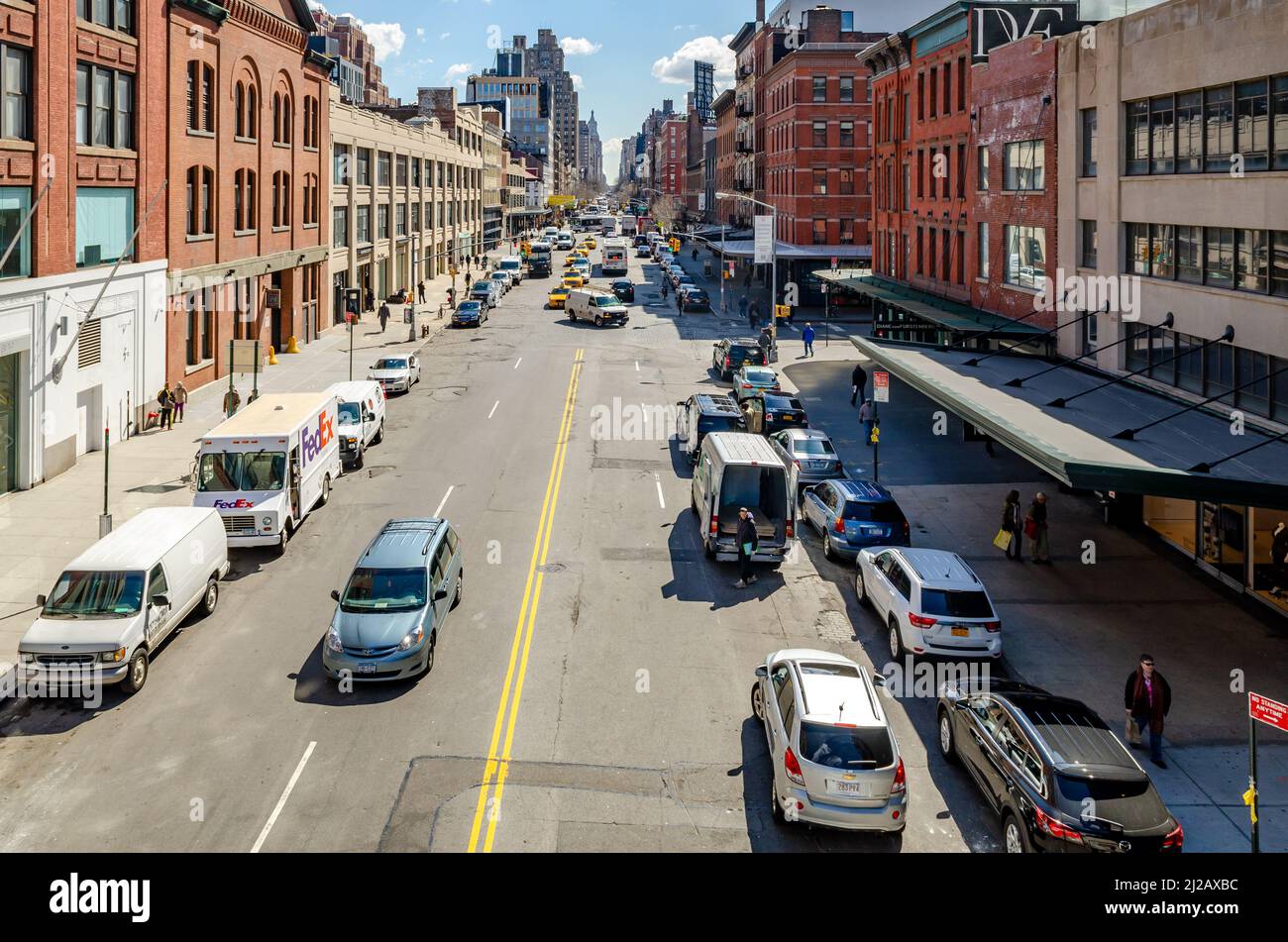 Chelsea city Street with lots of parked cars next to the street and ...