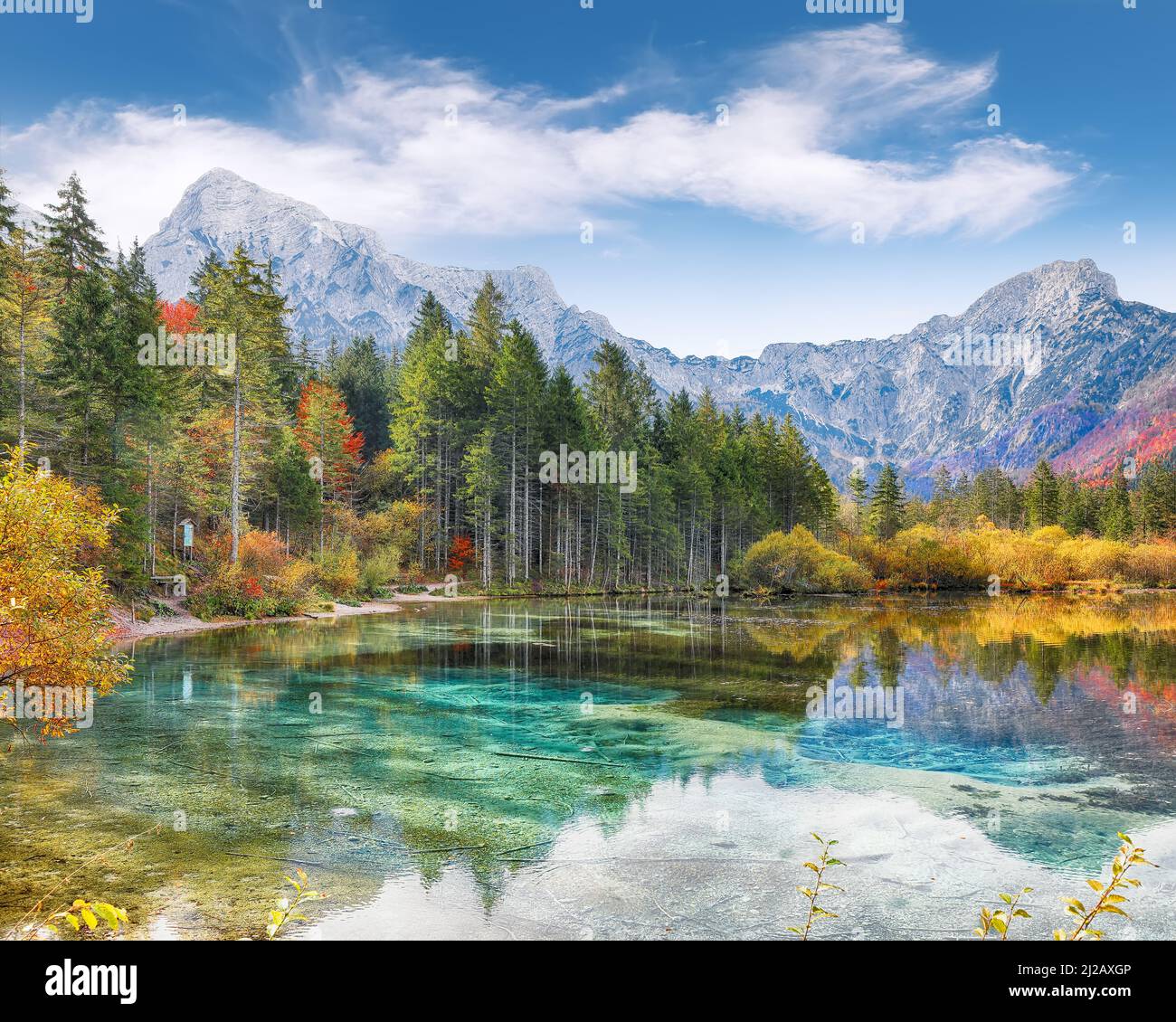 Stunning autumn scene of sunny morning on Almsee lake. Poppular travell ...