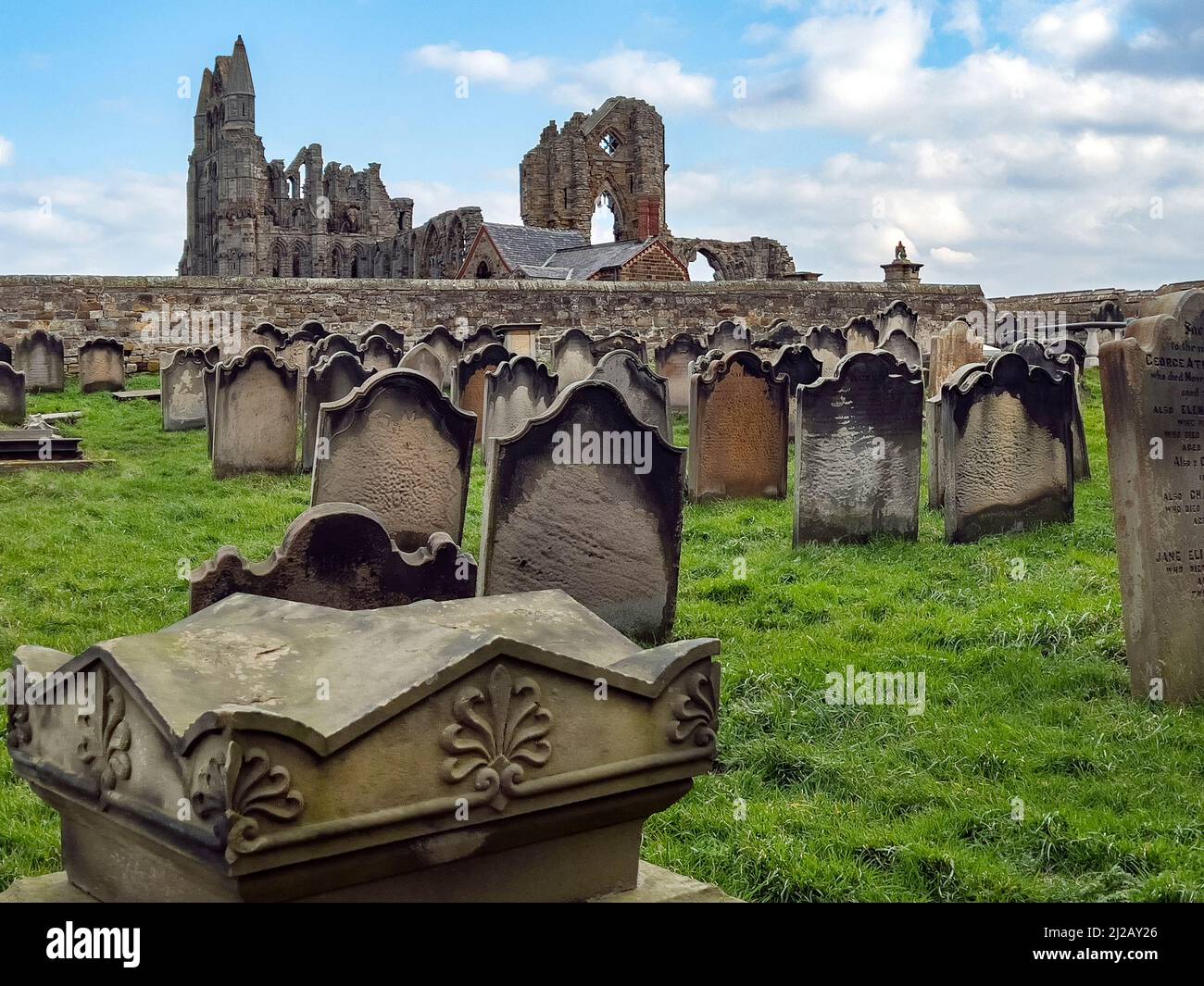 View of the ruins of Whitby Abbey from the graveyard of the Church of ...