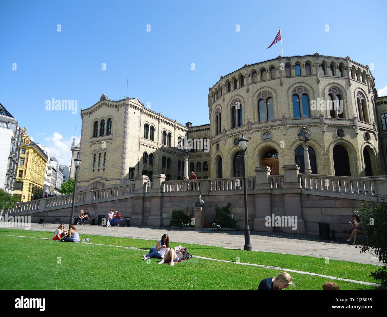 People sunbathing at Storting building Stock Photo - Alamy