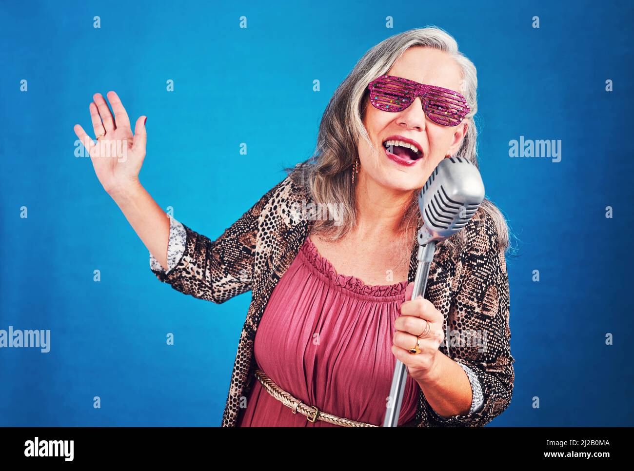 Beautiful mature woman singing in hi-res stock photography and images ...
