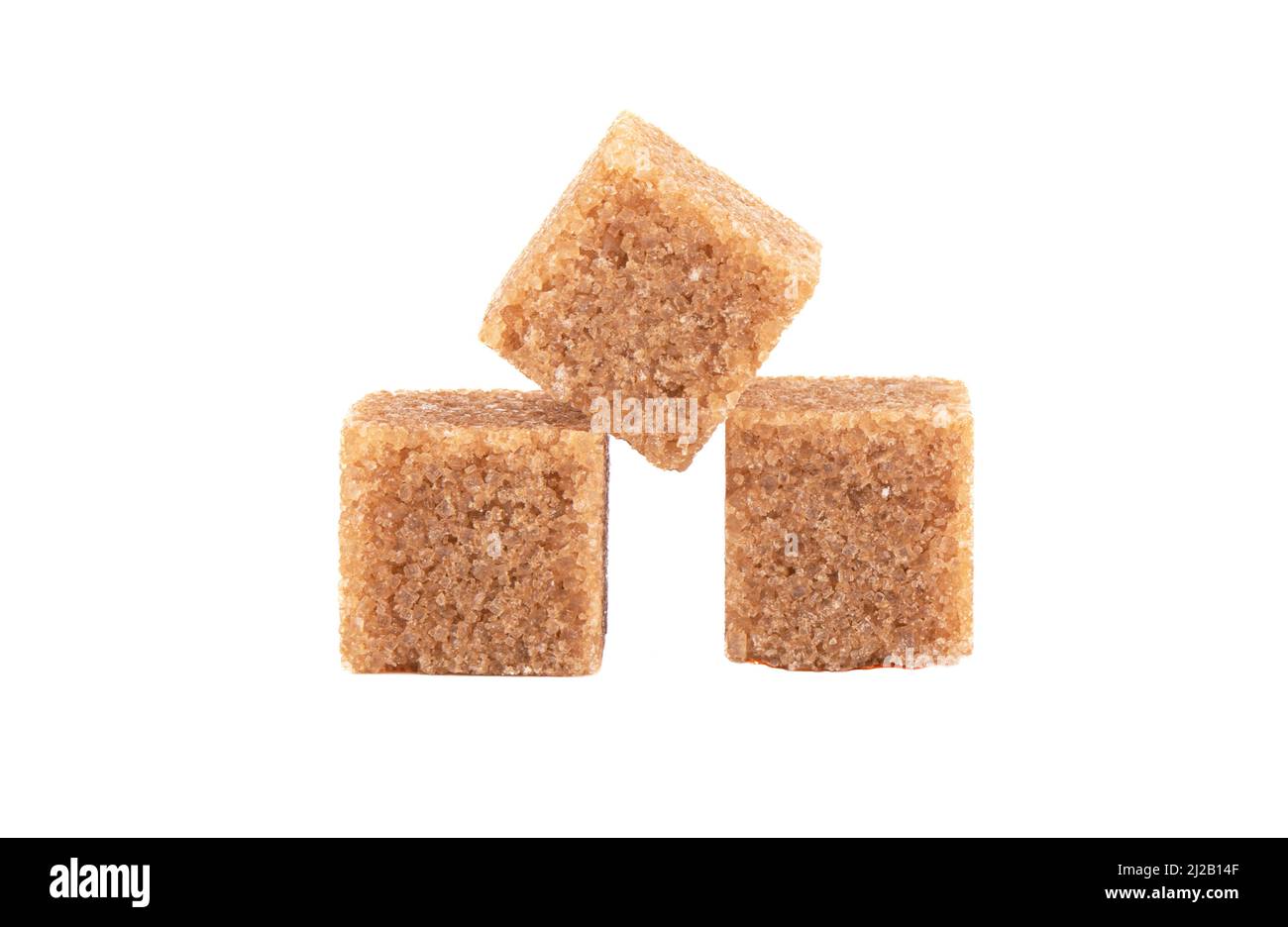 Three cubes of refined cane sugar isolated on white background. Close ...