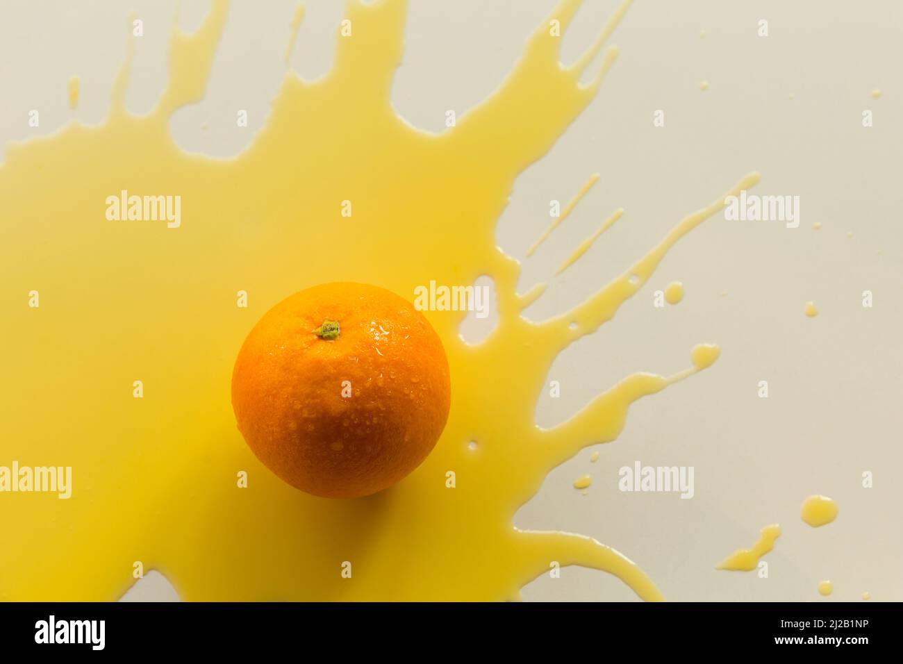 Creative photography, spilled orange juice Stock Photo - Alamy