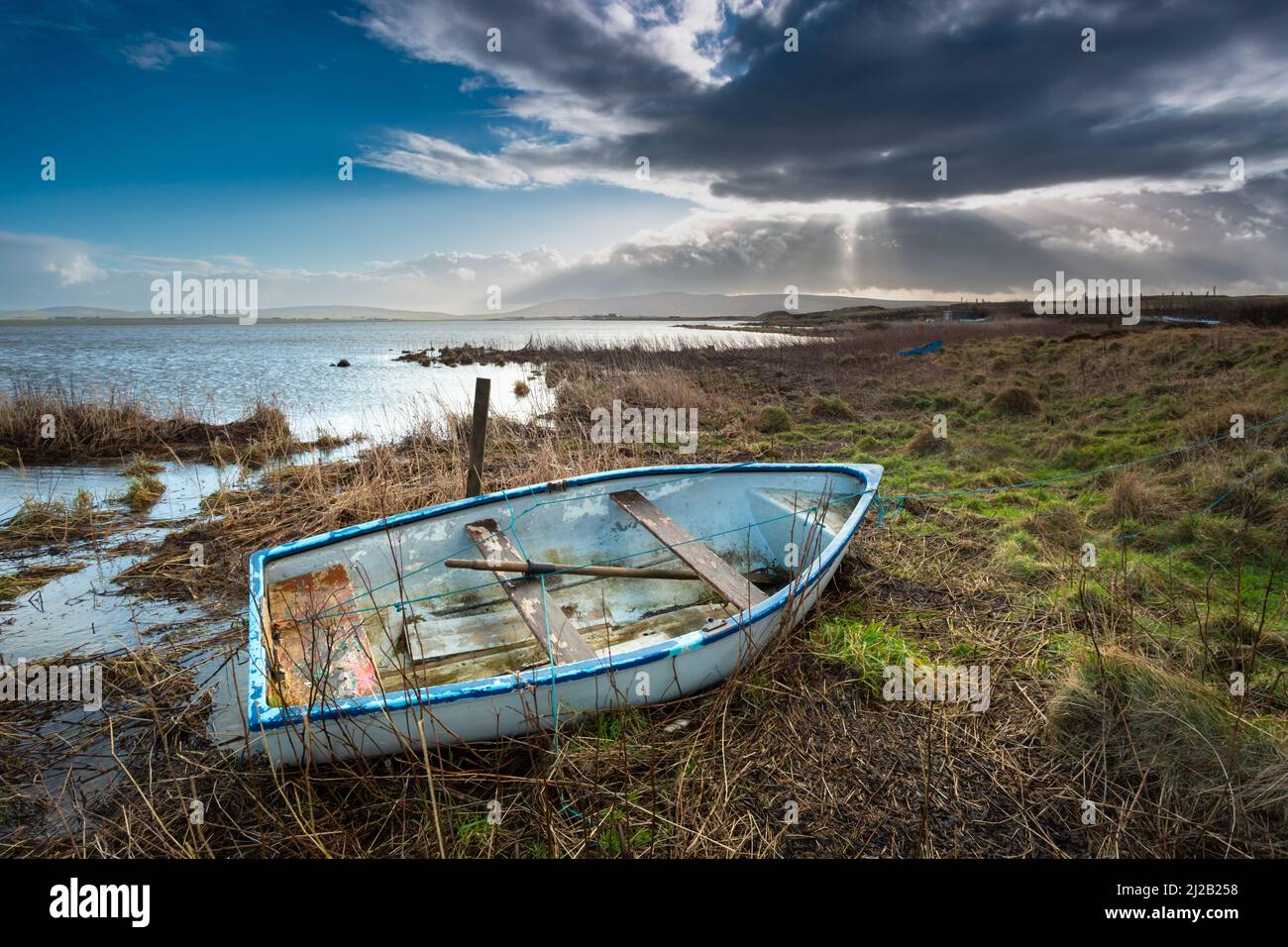 Old rowing boat on the loch Stenness, Orkney Islands, UK Stock Photo ...