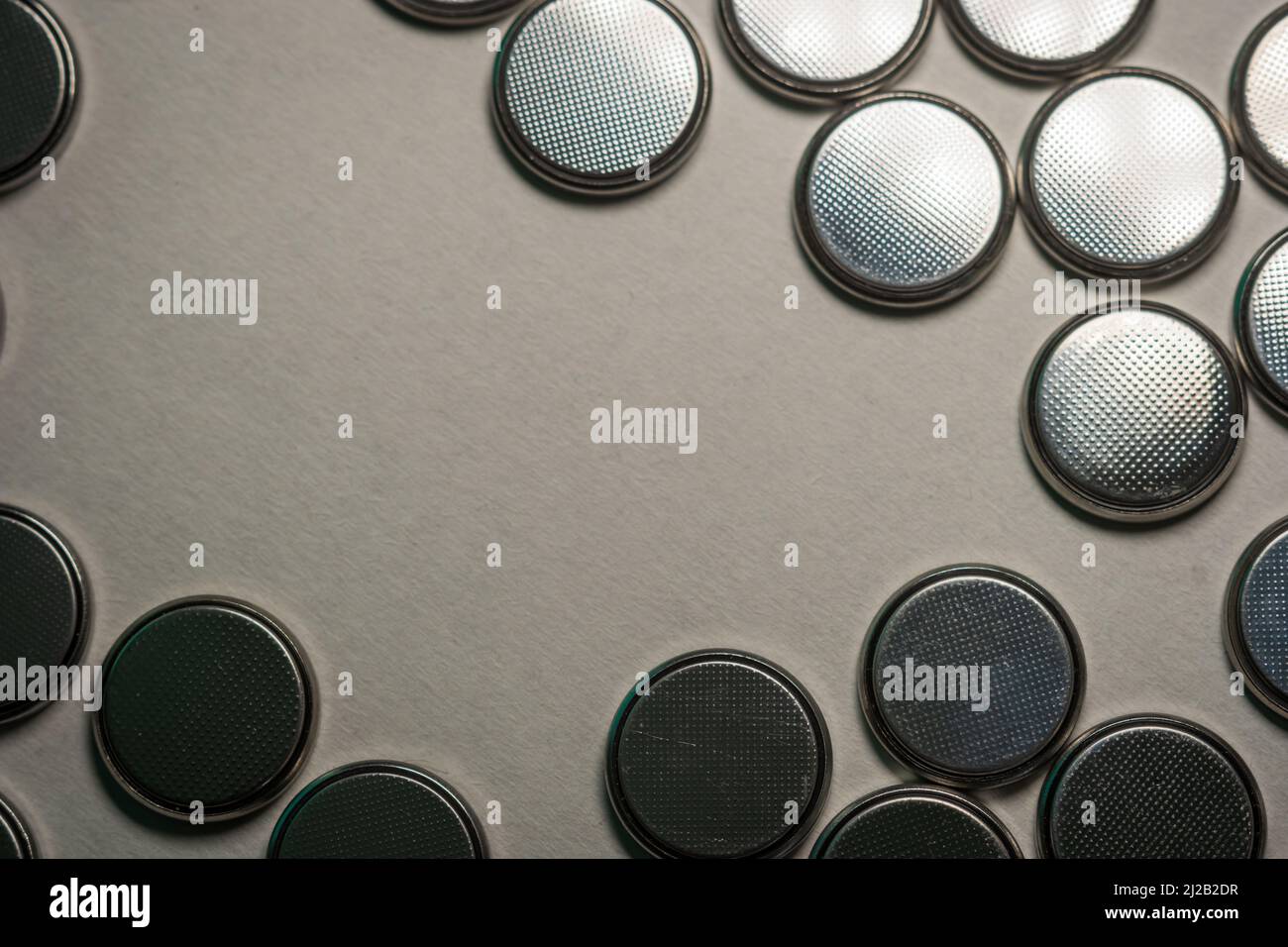 CR2032 coin cell batteries background closeup pan slide Stock Photo - Alamy