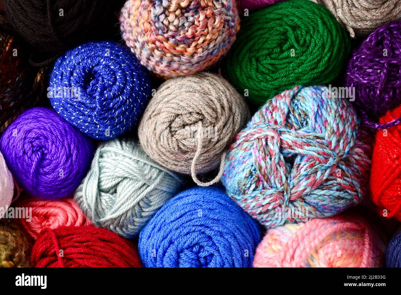 Full frame of colorful, assorted yarns Stock Photo - Alamy