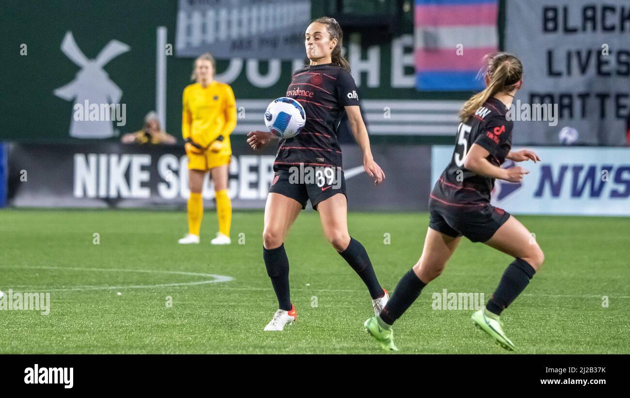 Thorns defender Meaghan Nally brings the ball down with her tummy in ...