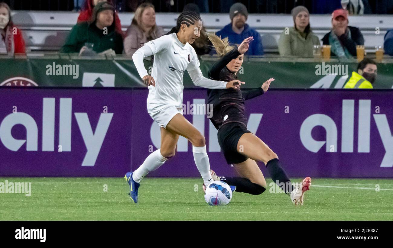 Thorns' Kelli Hubly goes to the ground to block the shot of US Team ...