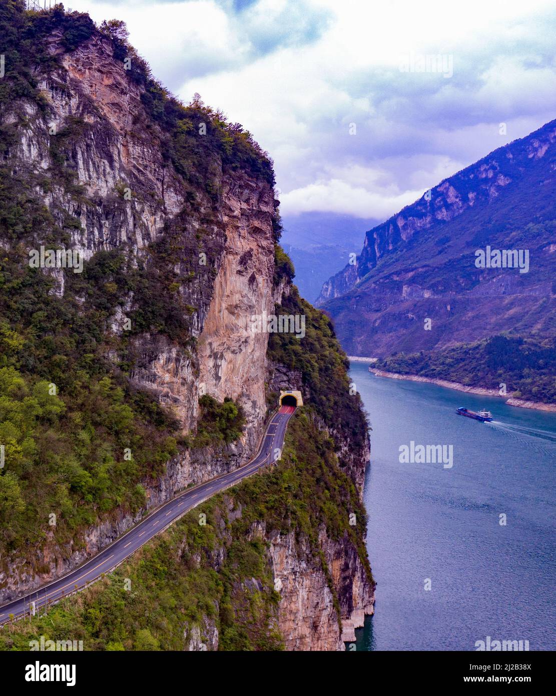 Cargo ships run on the Xiling Gorge of the Yangtze River in Zigui ...