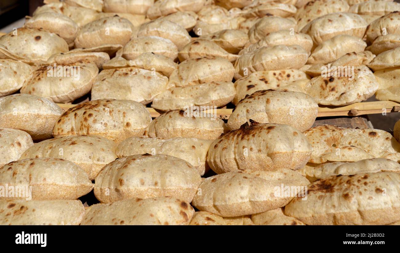 Egyptian fresh bread Aish Baladi in the street market Stock Photo - Alamy
