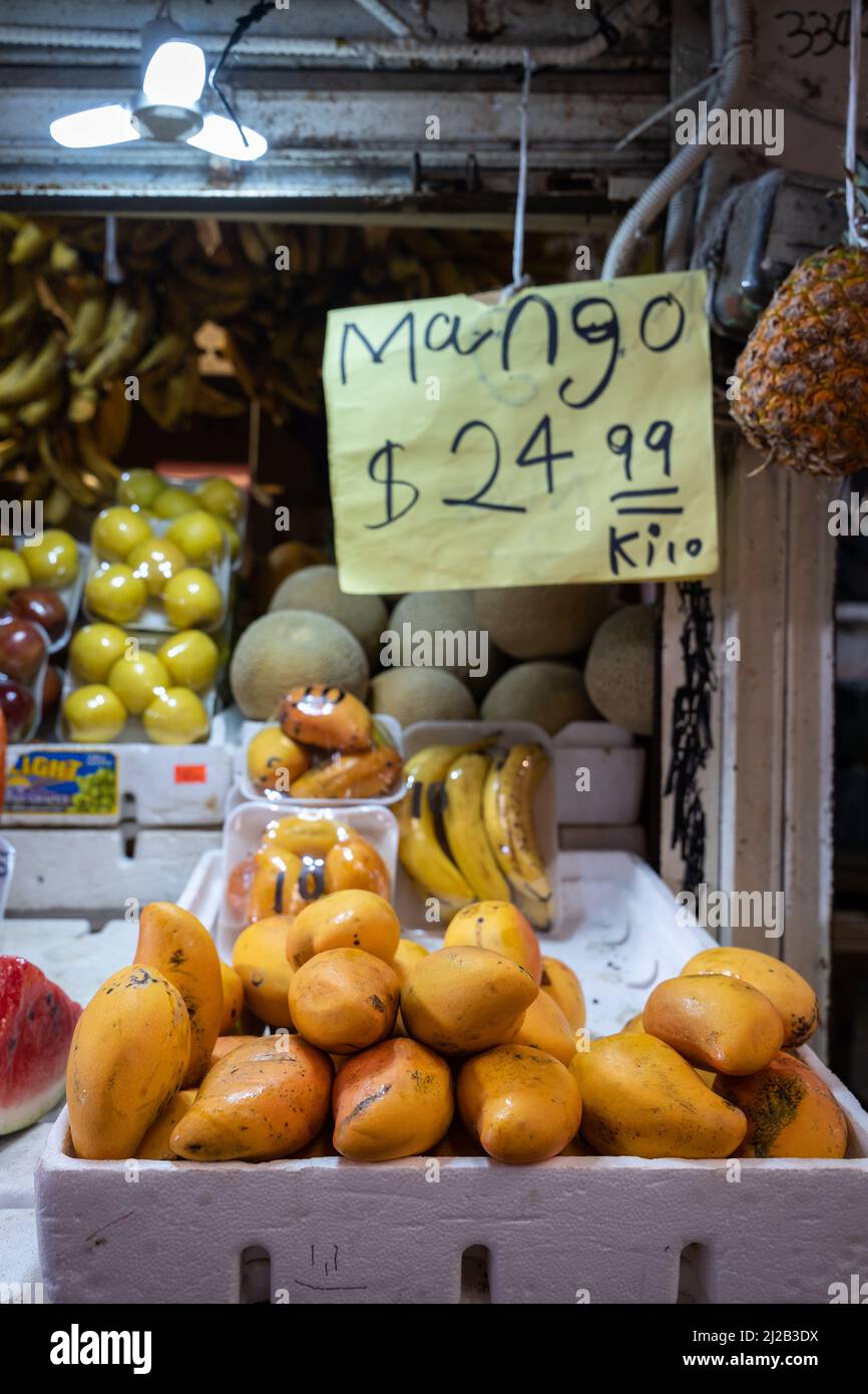 Fresh mango on display at a market in Mexico with the price in local ...