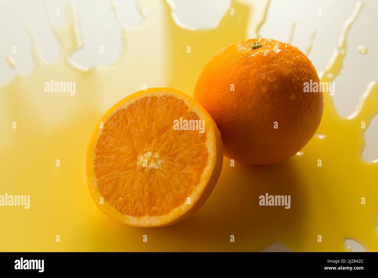 Spilled orange juice, creative photography Stock Photo - Alamy