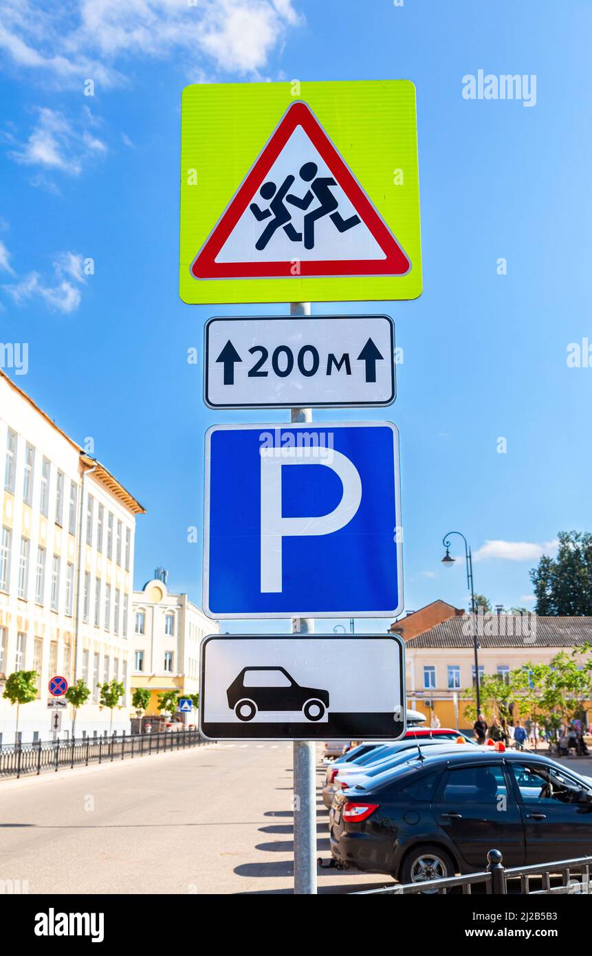Various road signs at the city street in summer sunny day Stock Photo ...