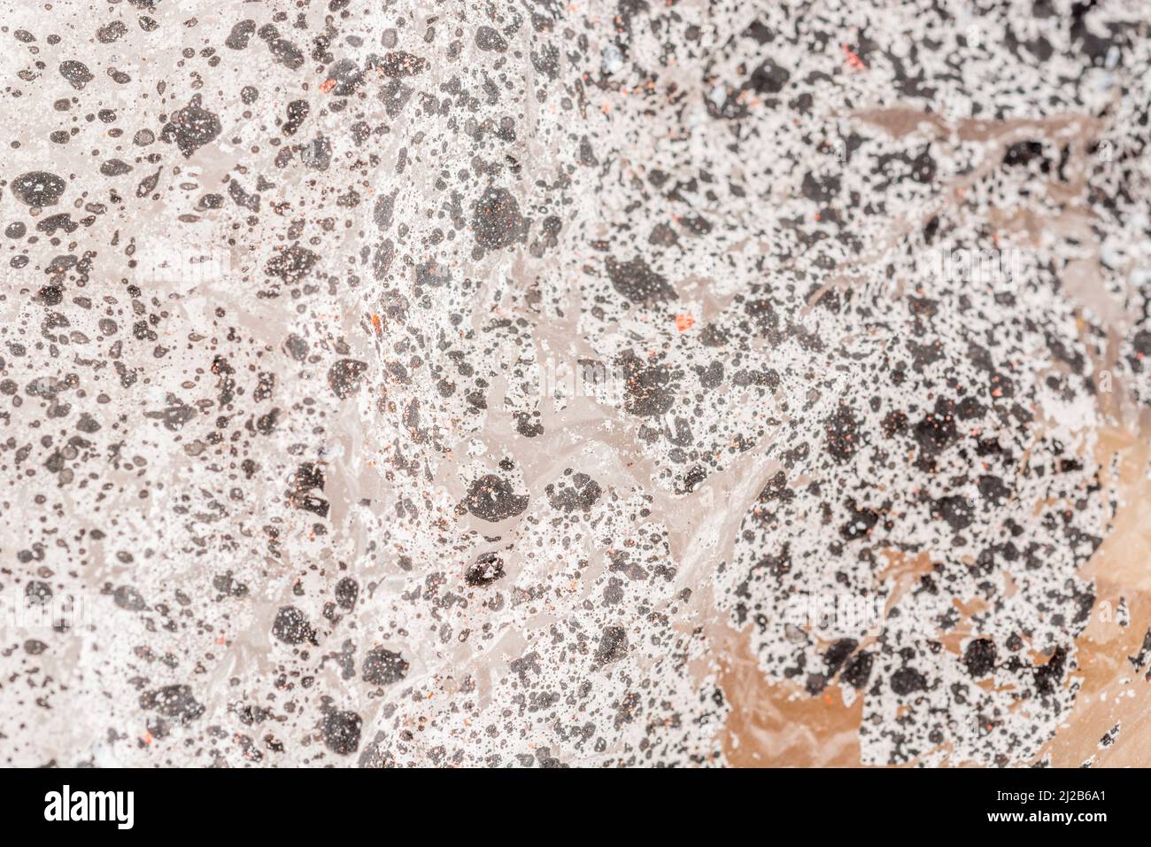 Close-up texture of paint covered plastic dust sheet covered by flaking ...