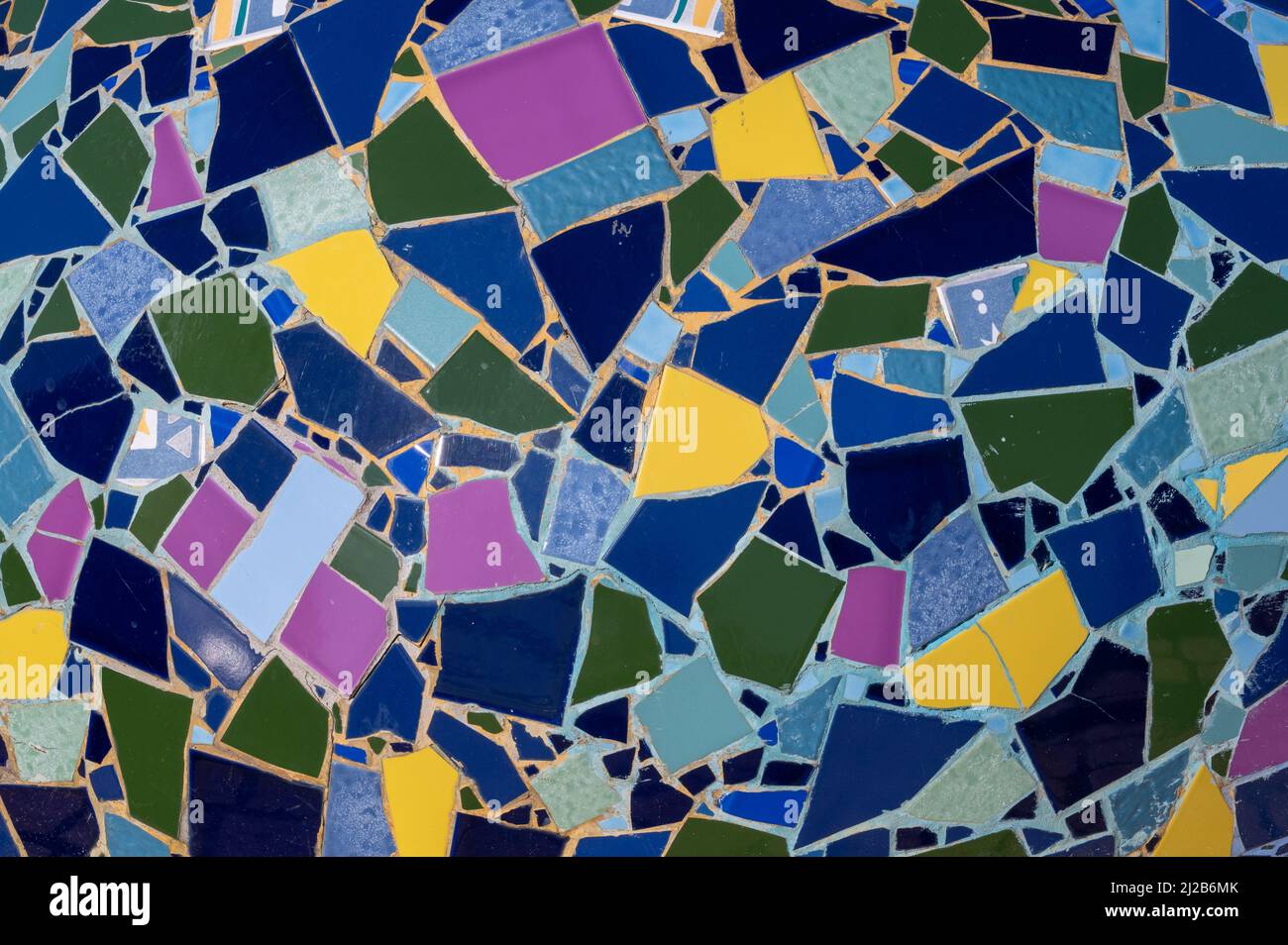 Wall decoration with ceramic mosaics of bright colors and unequal sizes ...